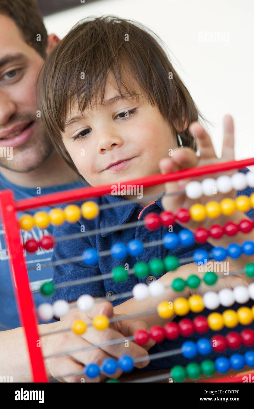 Child using abacus hi-res stock photography and images - Alamy