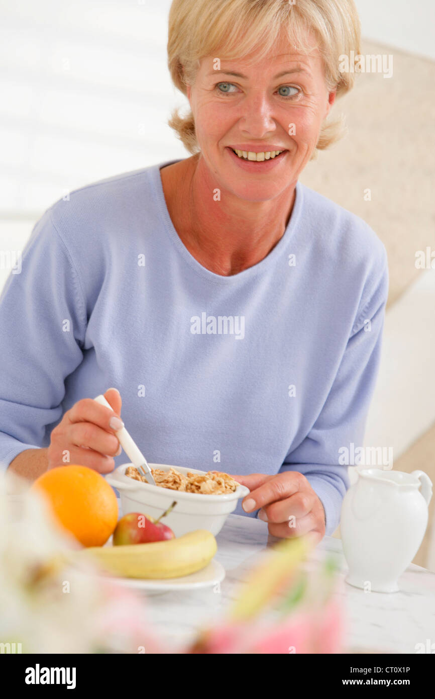 ELDERLY PERSON EATING BREAKFAST Stock Photo - Alamy