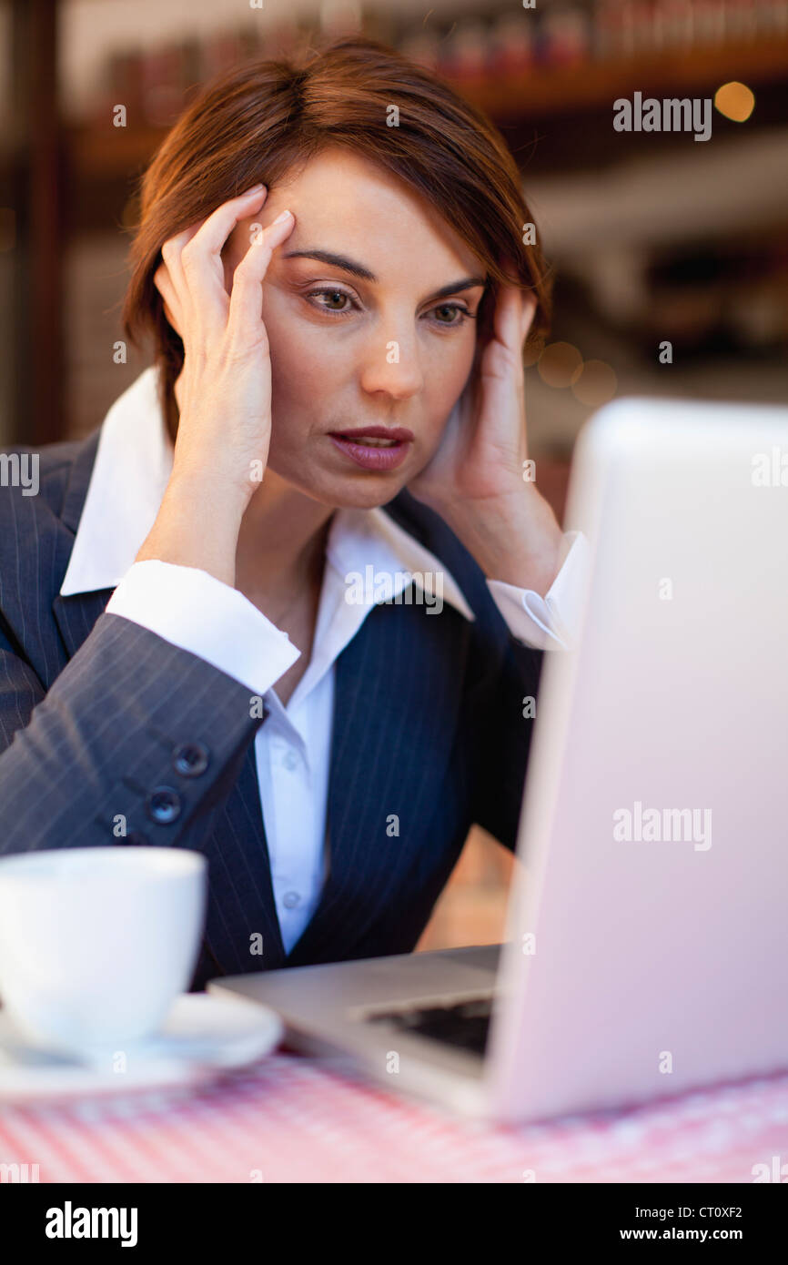 Laptop stressed coffee woman cafe hi-res stock photography and images ...