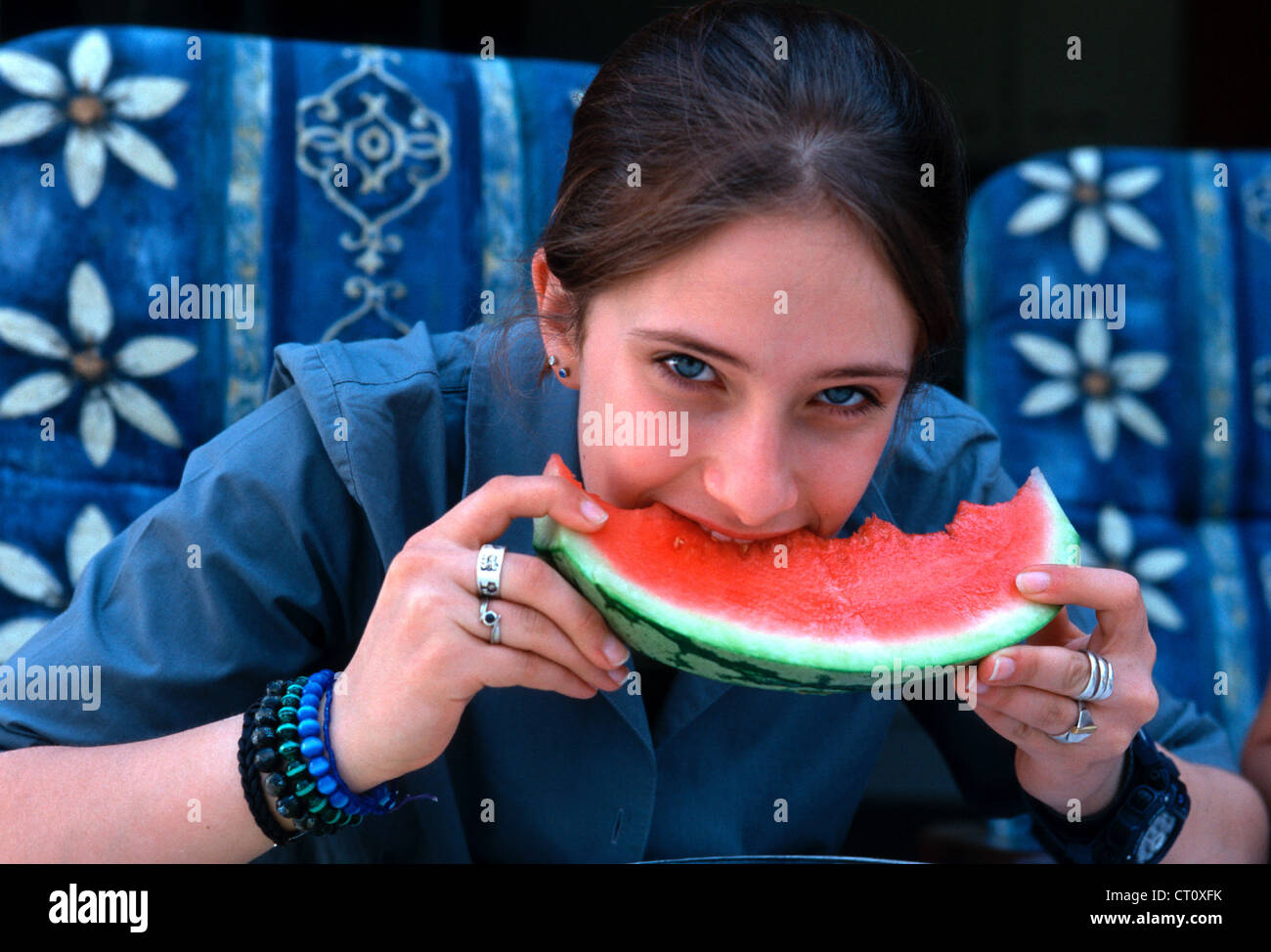 Young people eating a watermelon Stock Photo - Alamy