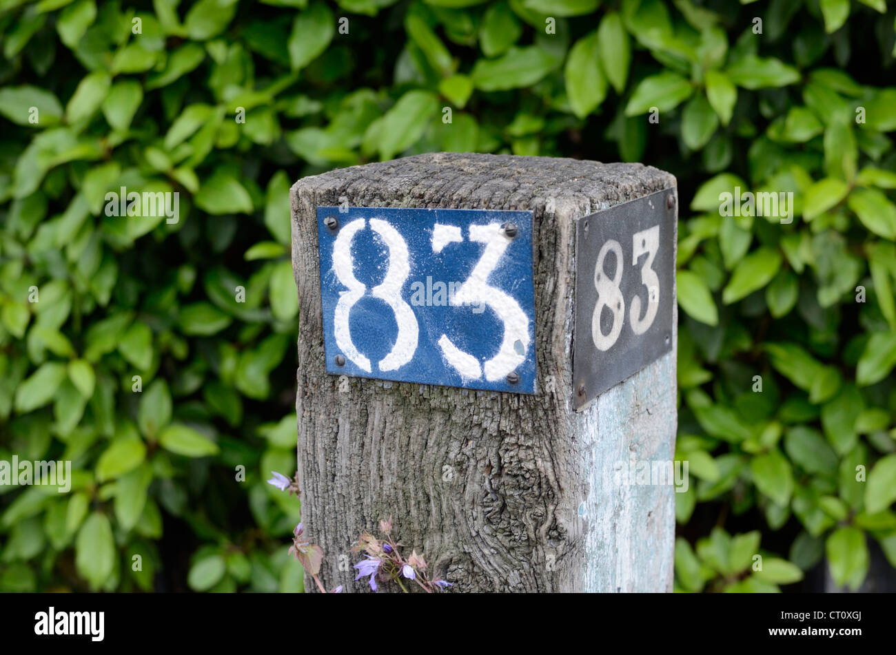 The number 83 on a gatepost Stock Photo - Alamy