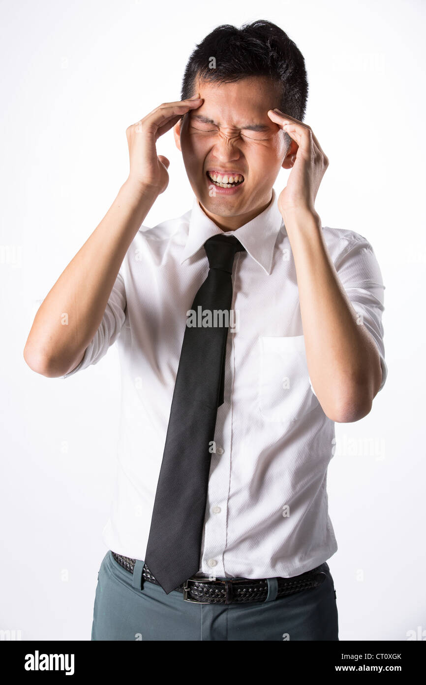 Man holding his head in distress Stock Photo - Alamy