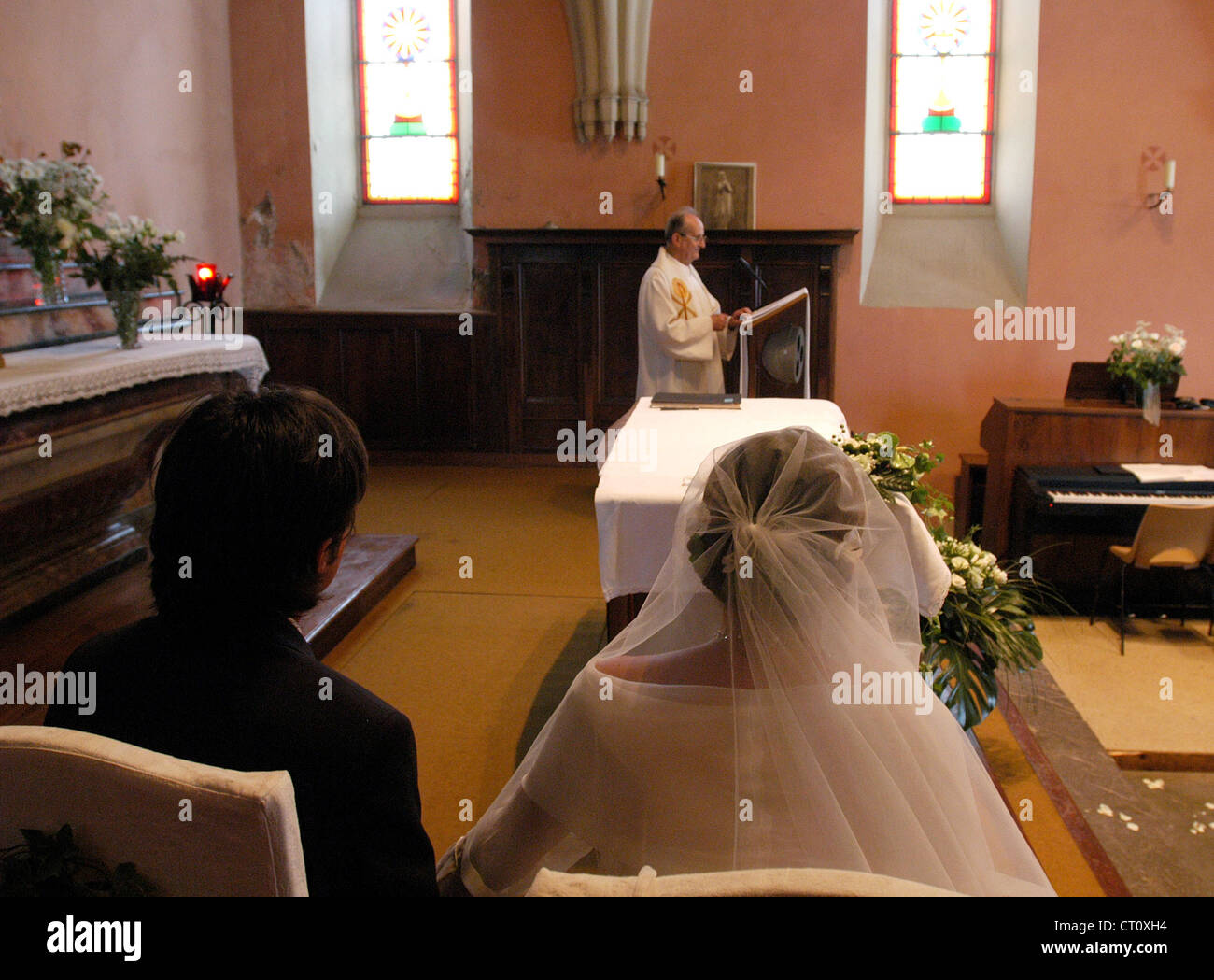 Wedding couple marry in a church Stock Photo - Alamy