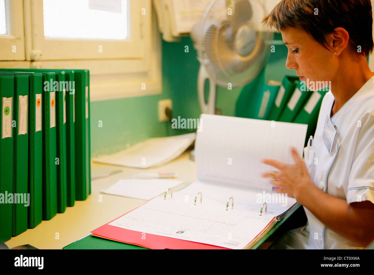NURSE WITH PATIENT'S RECORD Stock Photo - Alamy