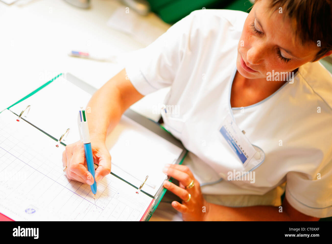 NURSE WITH PATIENT'S RECORD Stock Photo - Alamy