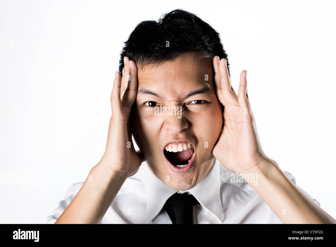 Man holding his head in distress Stock Photo - Alamy