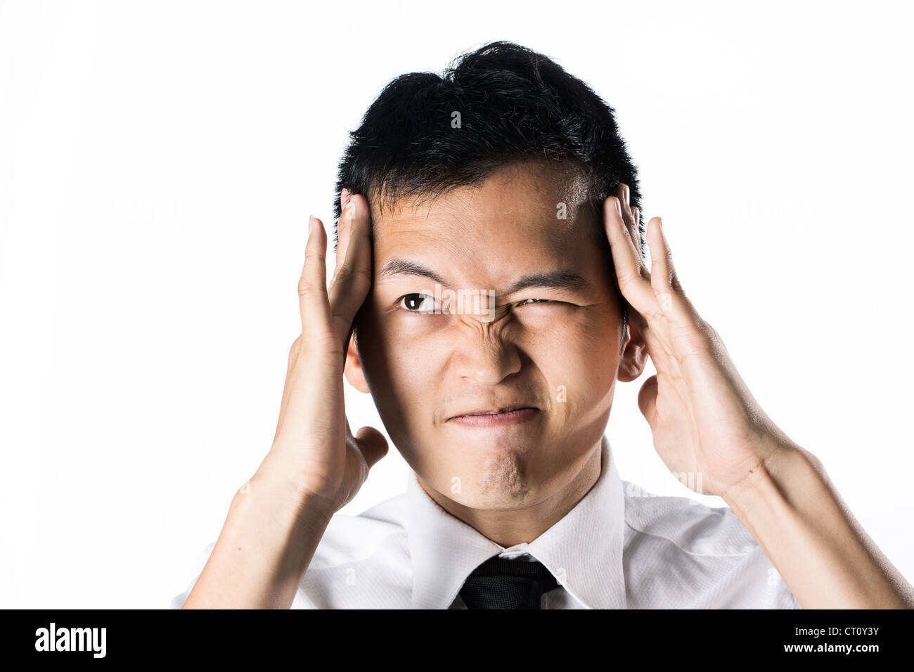 Man holding his head in distress Stock Photo - Alamy