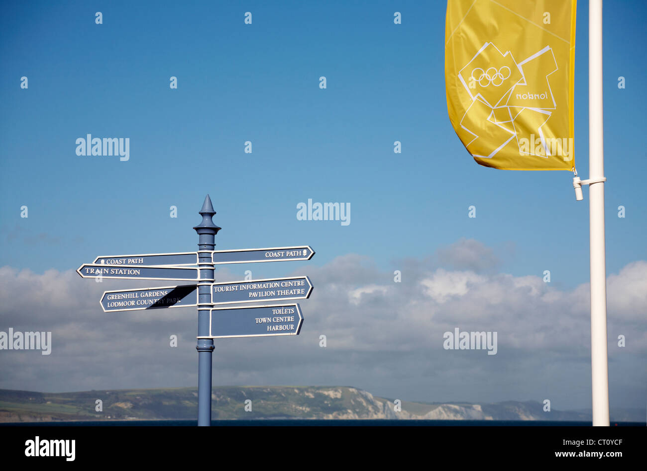 Direction signs at Weymouth with Olympic flag ay Weymouth, Dorset UK in ...