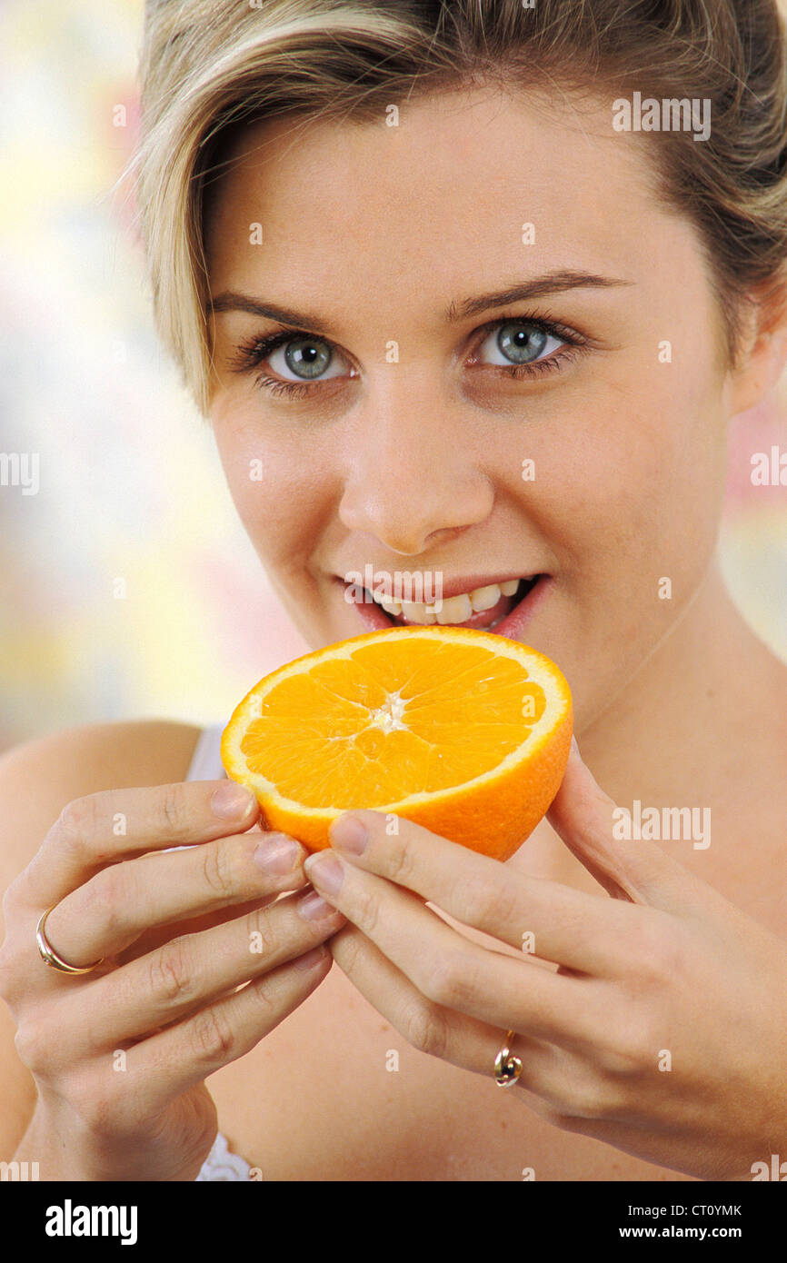WOMAN EATING FRUIT Stock Photo - Alamy