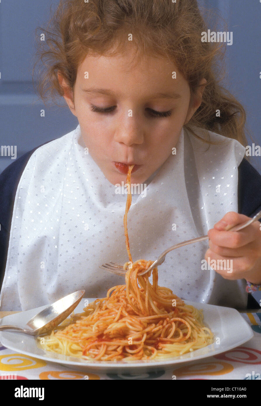 CHILD EATING STARCHY FOOD Stock Photo - Alamy