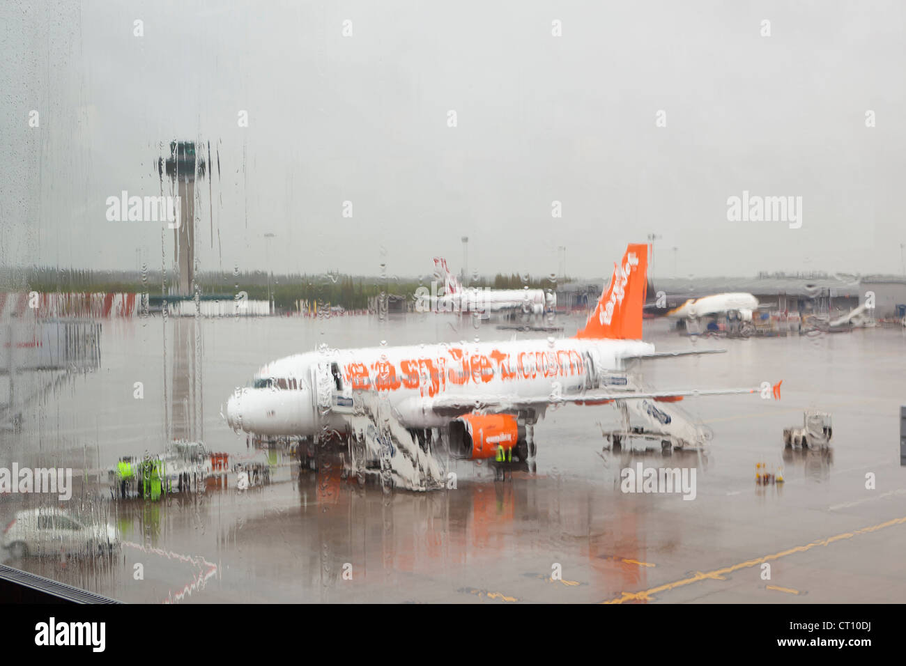 Easy Jet airplane on a rainy day at a UK airport Stock Photo - Alamy