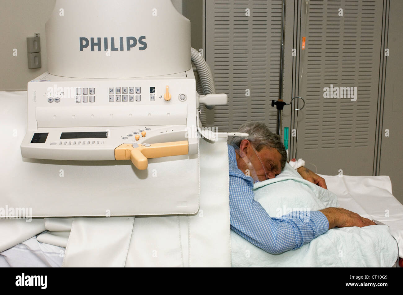 An elderly male patient undergoing a scan Stock Photo - Alamy