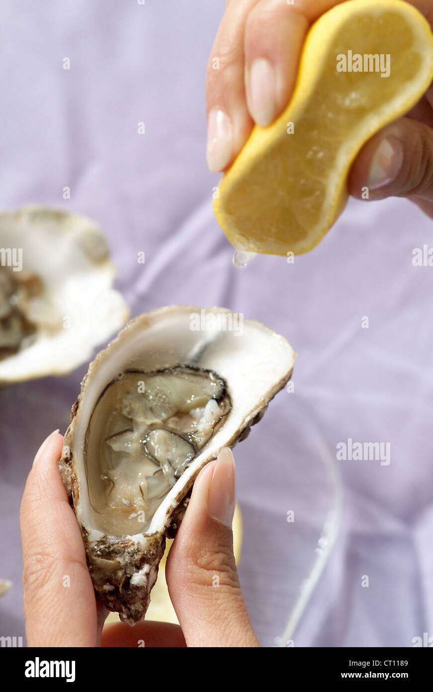 WOMAN EATING SELLFISH Stock Photo - Alamy