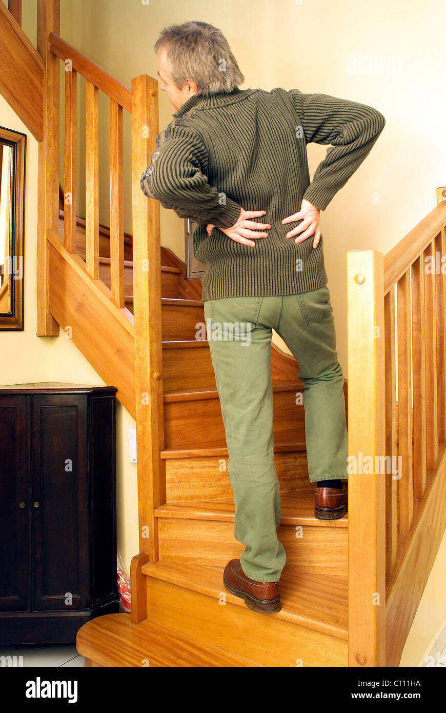 BACK PAIN IN AN ELDERLY PERSON Stock Photo - Alamy