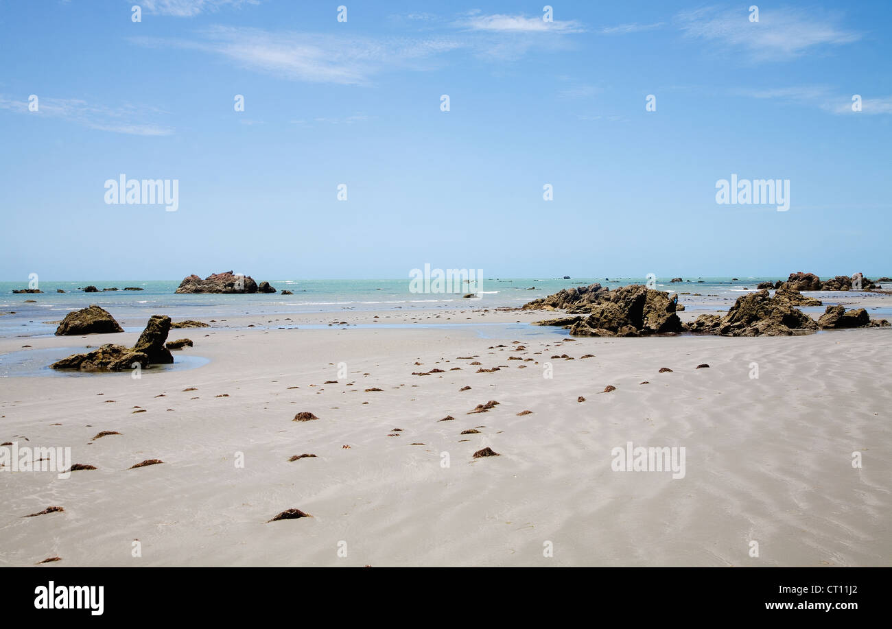Rocks on sandy beach Stock Photo - Alamy
