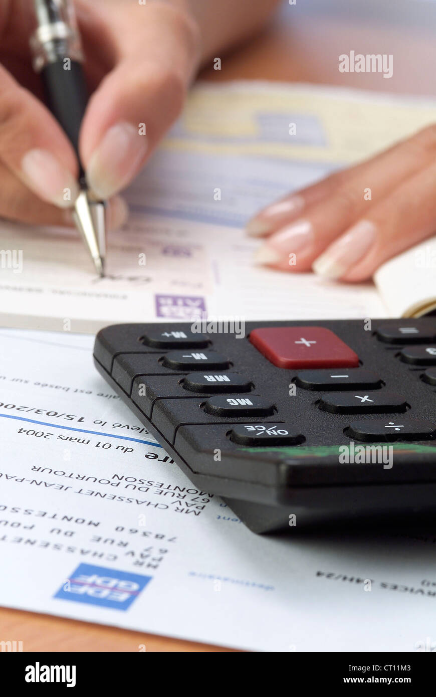 WOMAN DOING PAPERWORK Stock Photo - Alamy
