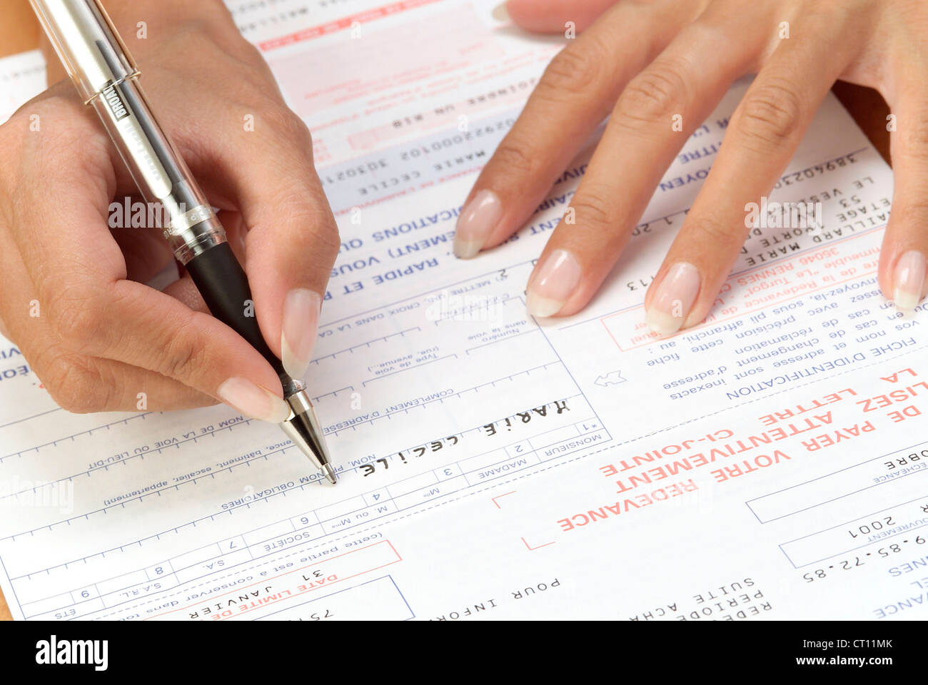 WOMAN DOING PAPERWORK Stock Photo - Alamy