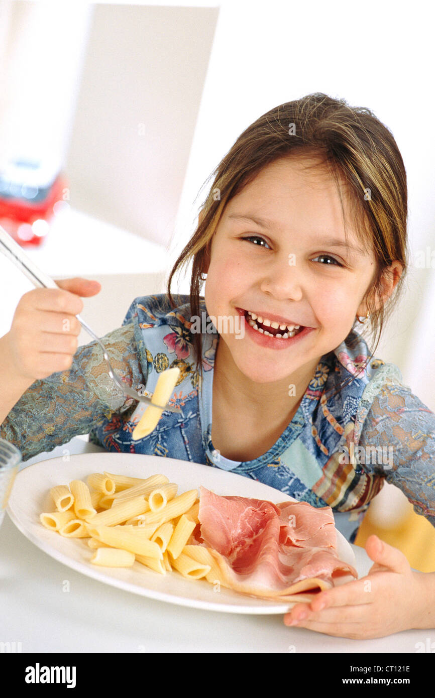 CHILD EATING MEAT Stock Photo - Alamy