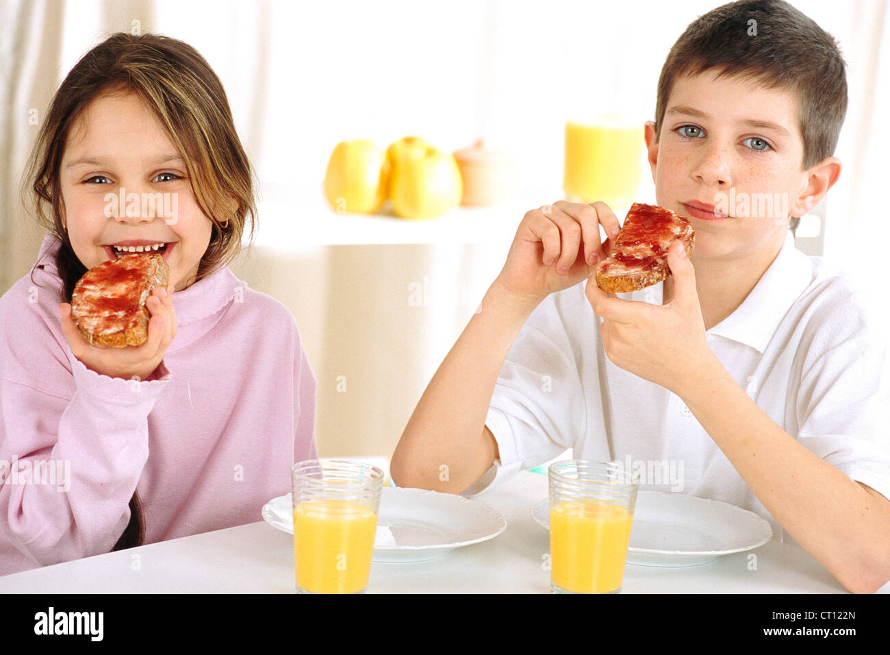 CHILD EATING BREAKFAST Stock Photo - Alamy
