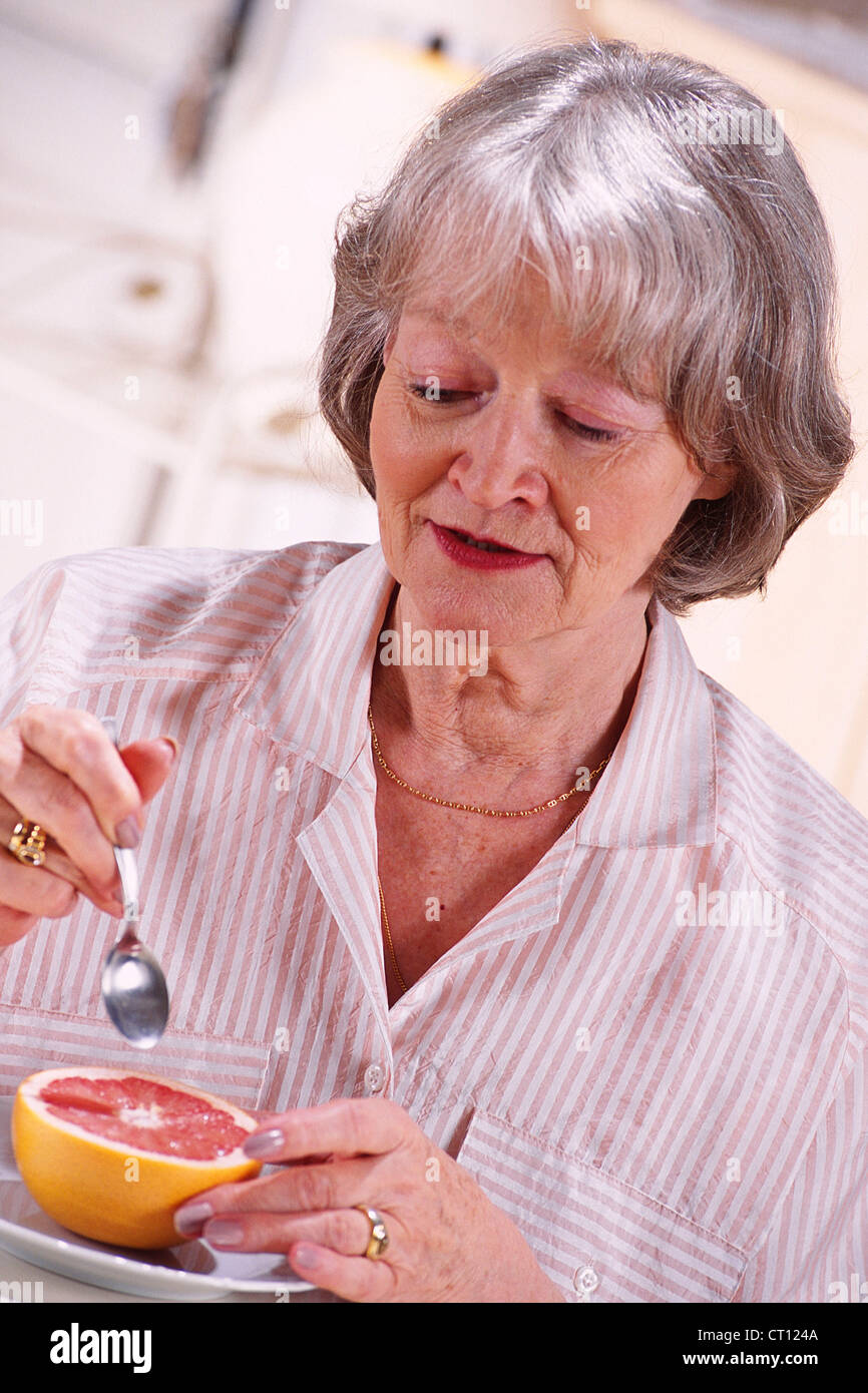 ELDERLY PERSON EATING FRUIT Stock Photo - Alamy