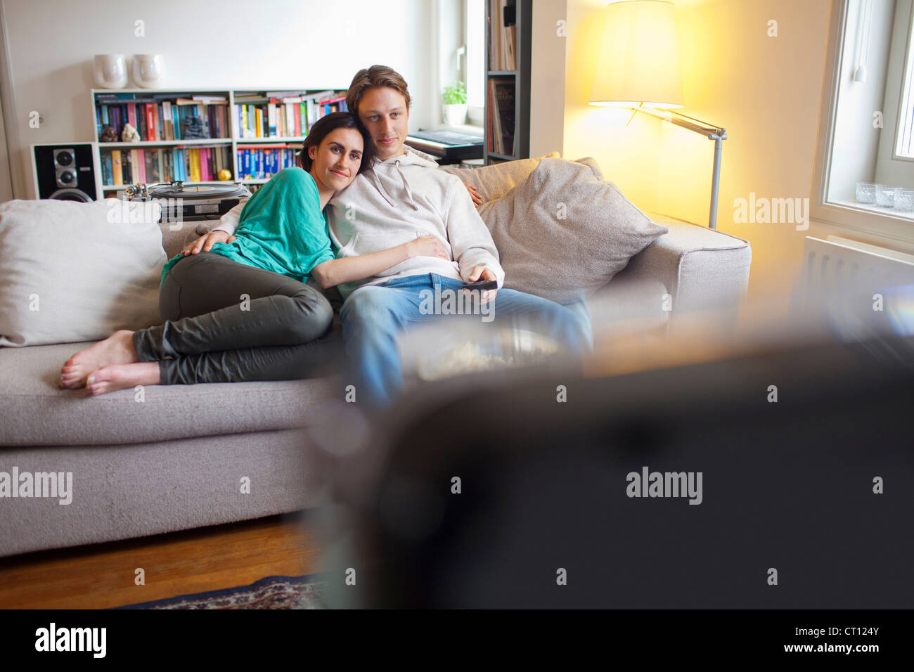 Couple watching television together Stock Photo - Alamy