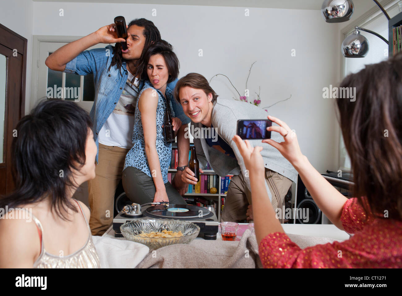 Friends taking pictures of themselves Stock Photo - Alamy