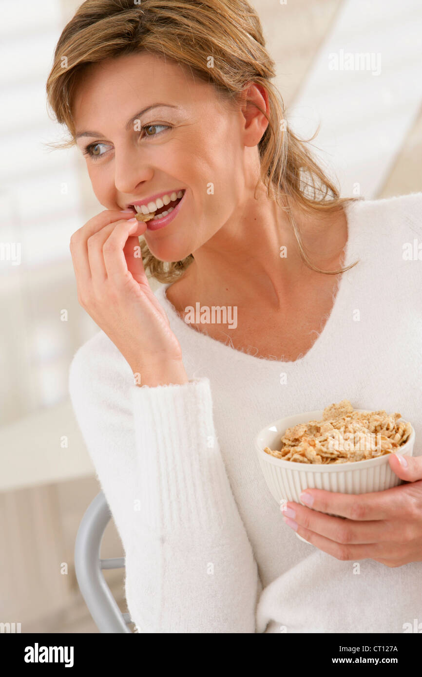 WOMAN EATING BREAKFAST Stock Photo - Alamy