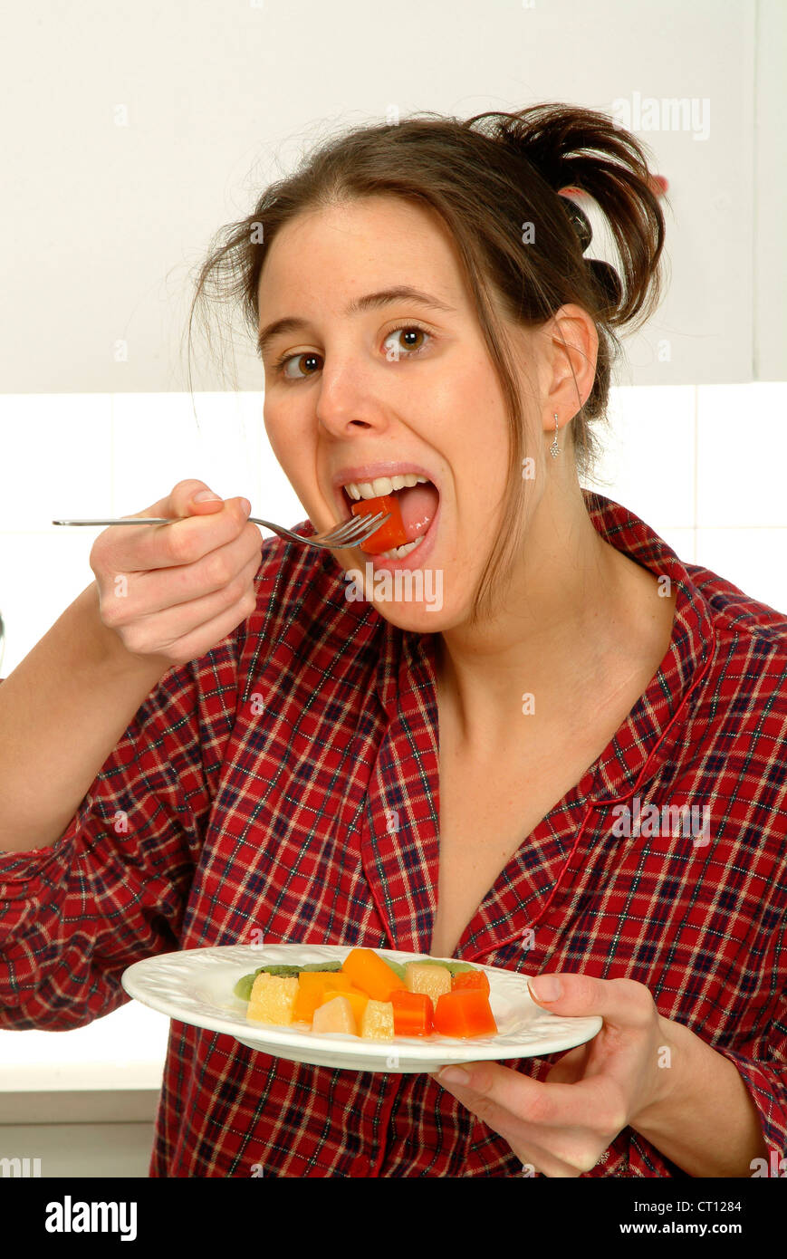 WOMAN EATING FRUIT Stock Photo - Alamy