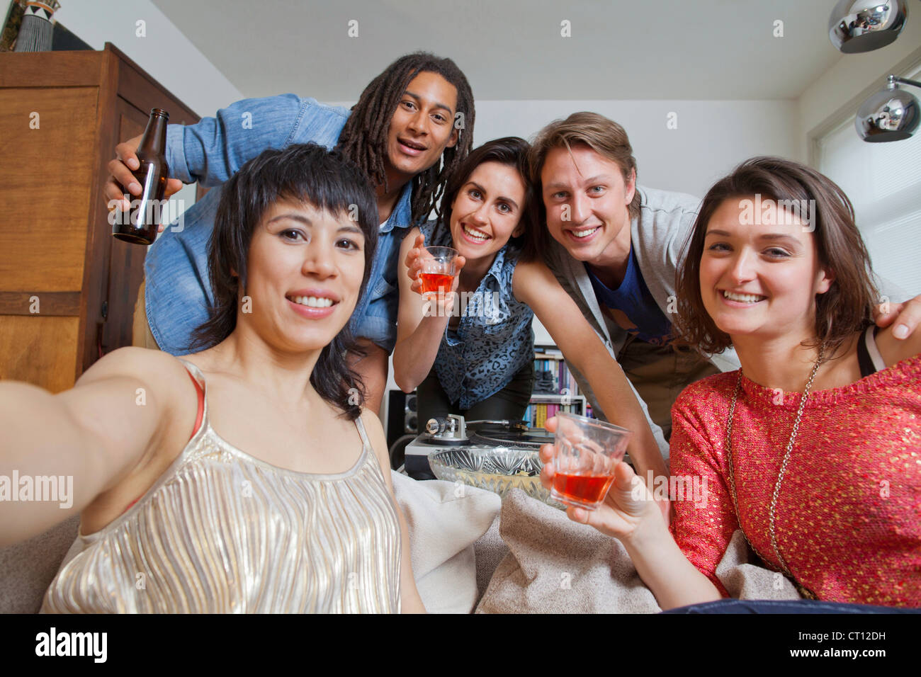 Friends taking pictures of themselves Stock Photo - Alamy