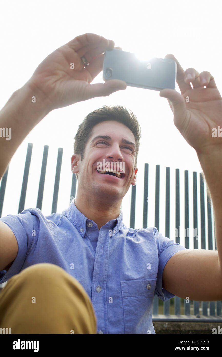 Sitting wall raised arm hi-res stock photography and images - Alamy
