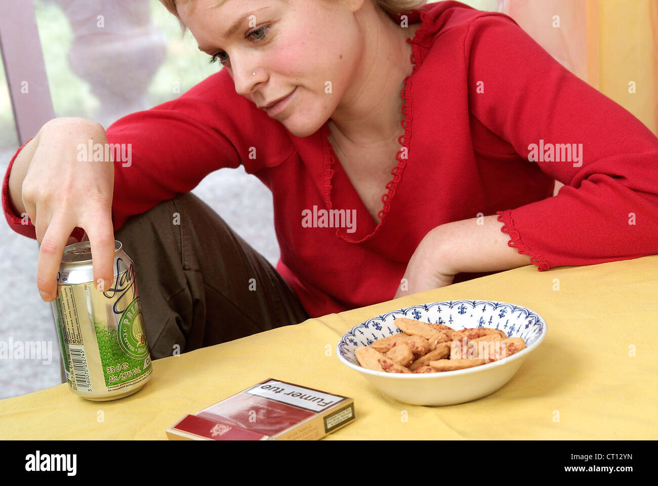 Woman smoking cigarette dinner hi-res stock photography and images - Alamy