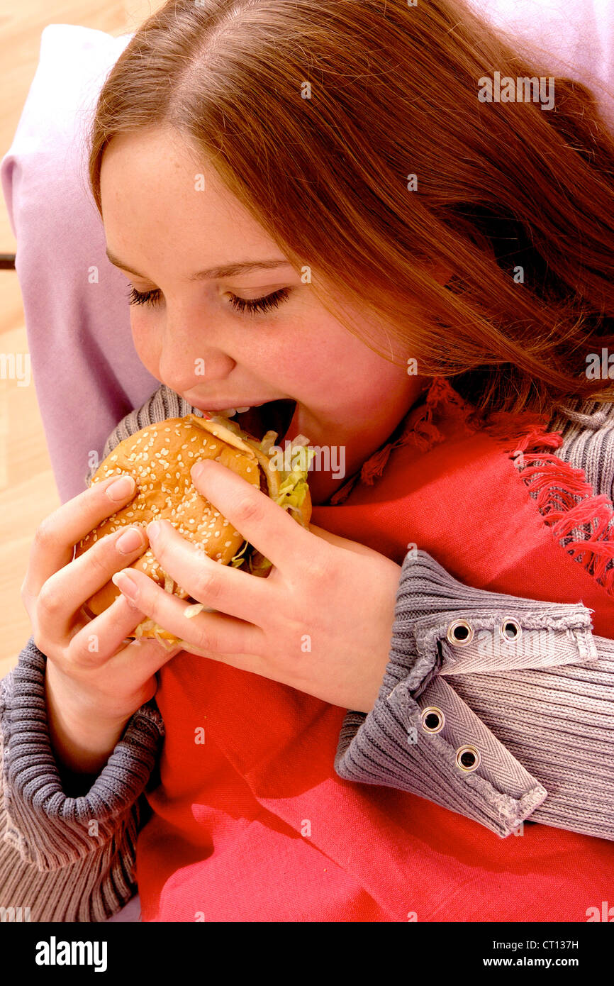 AN ADOLESCENT EATING Stock Photo - Alamy