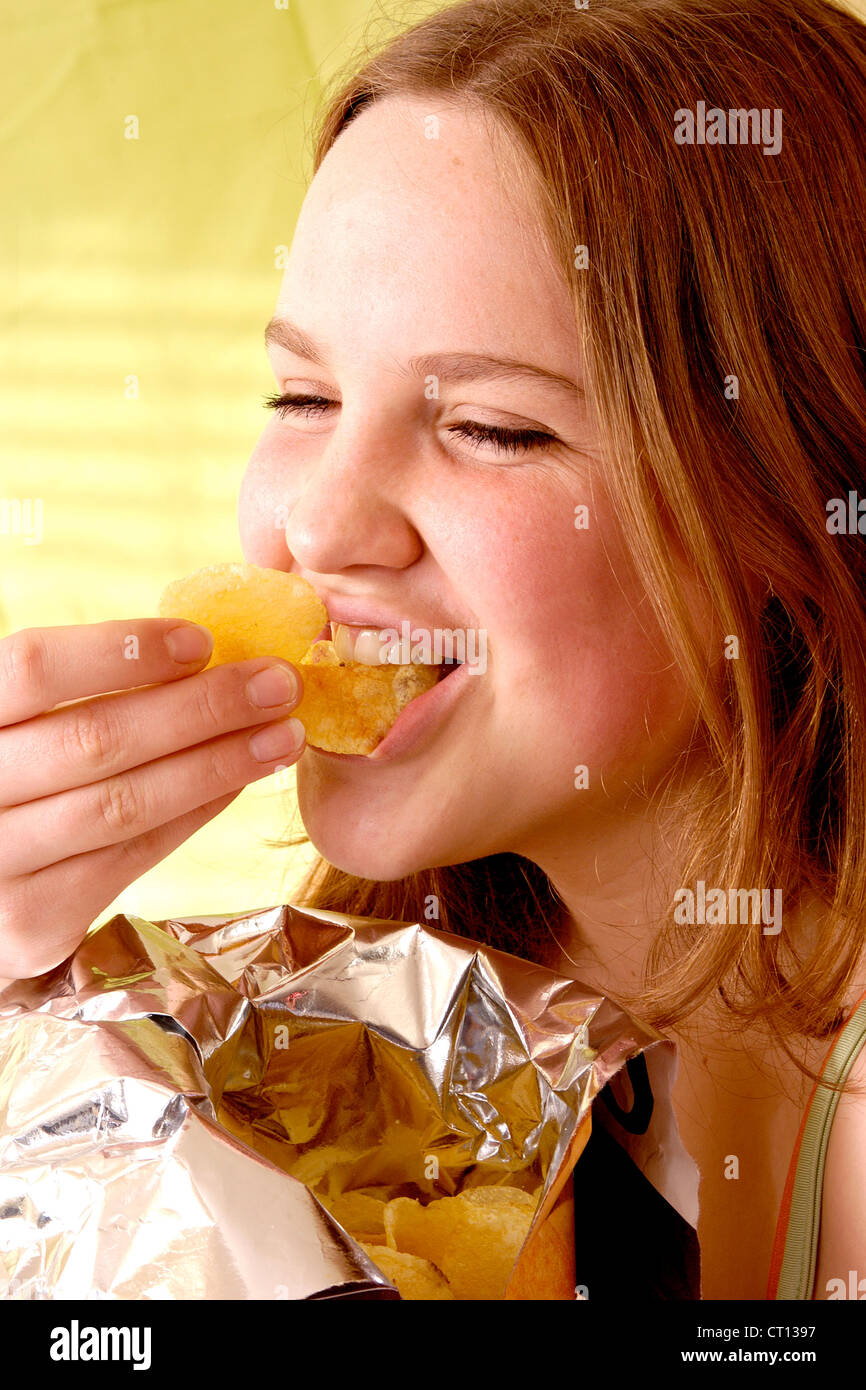 AN ADOLESCENT EATING Stock Photo - Alamy
