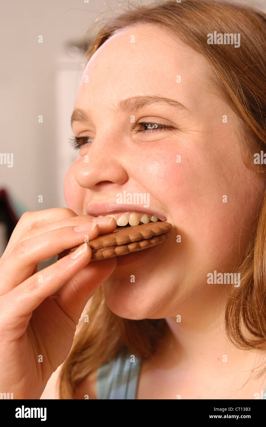 AN ADOLESCENT EATING Stock Photo - Alamy