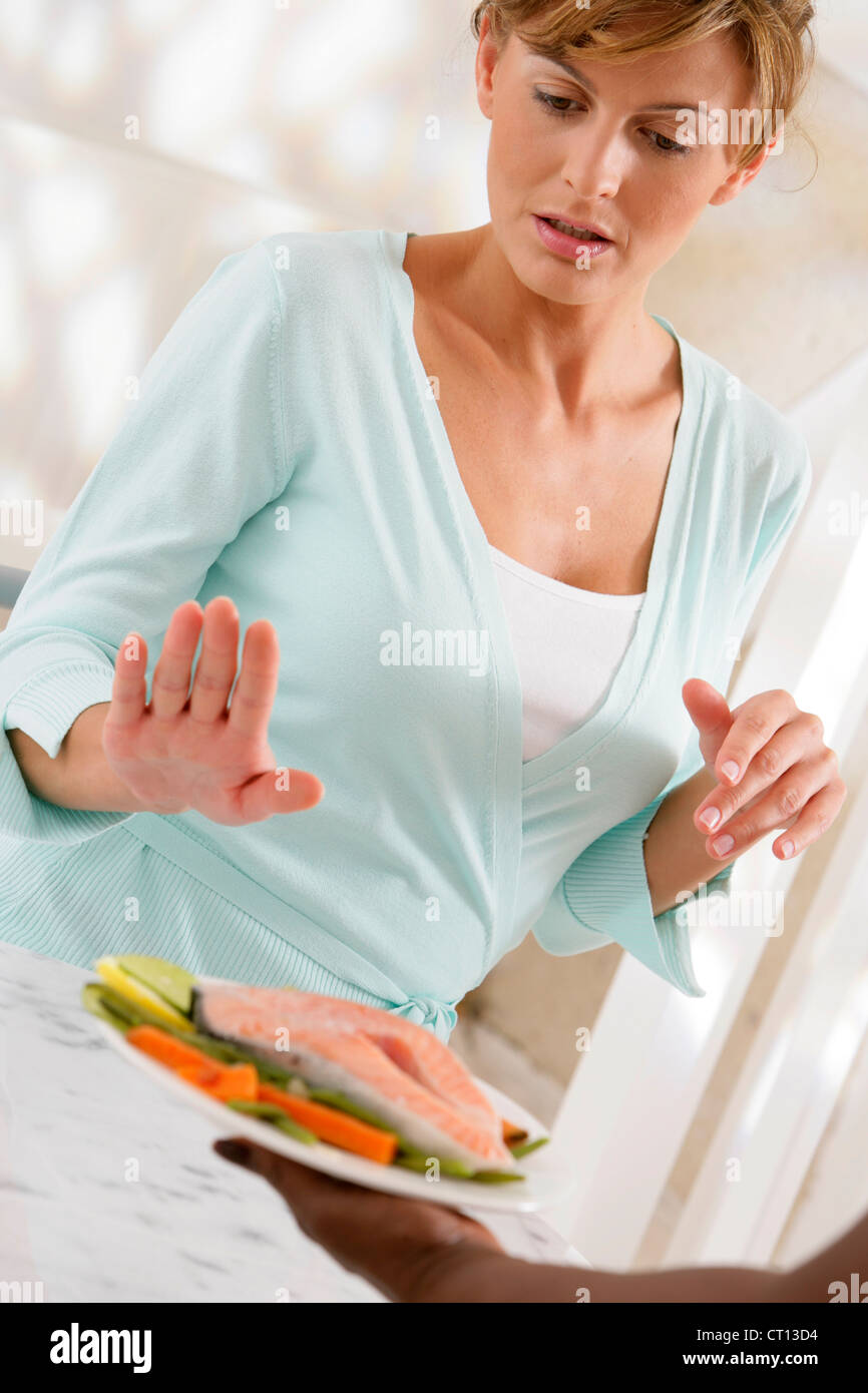 WOMAN EATING FISH Stock Photo - Alamy