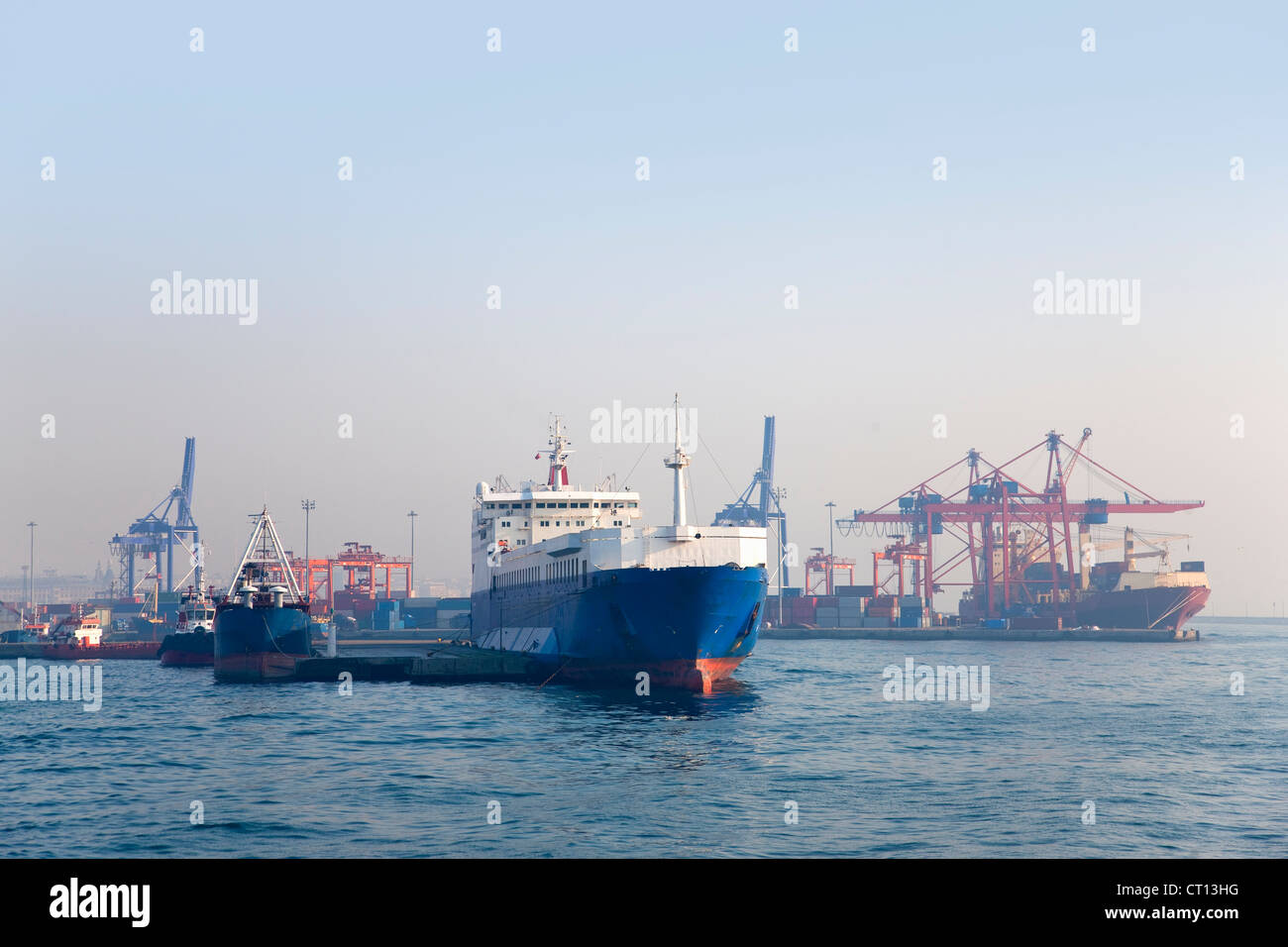 Container barges in urban bay Stock Photo - Alamy