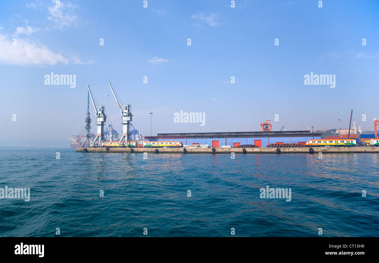 Container barges in urban bay Stock Photo - Alamy
