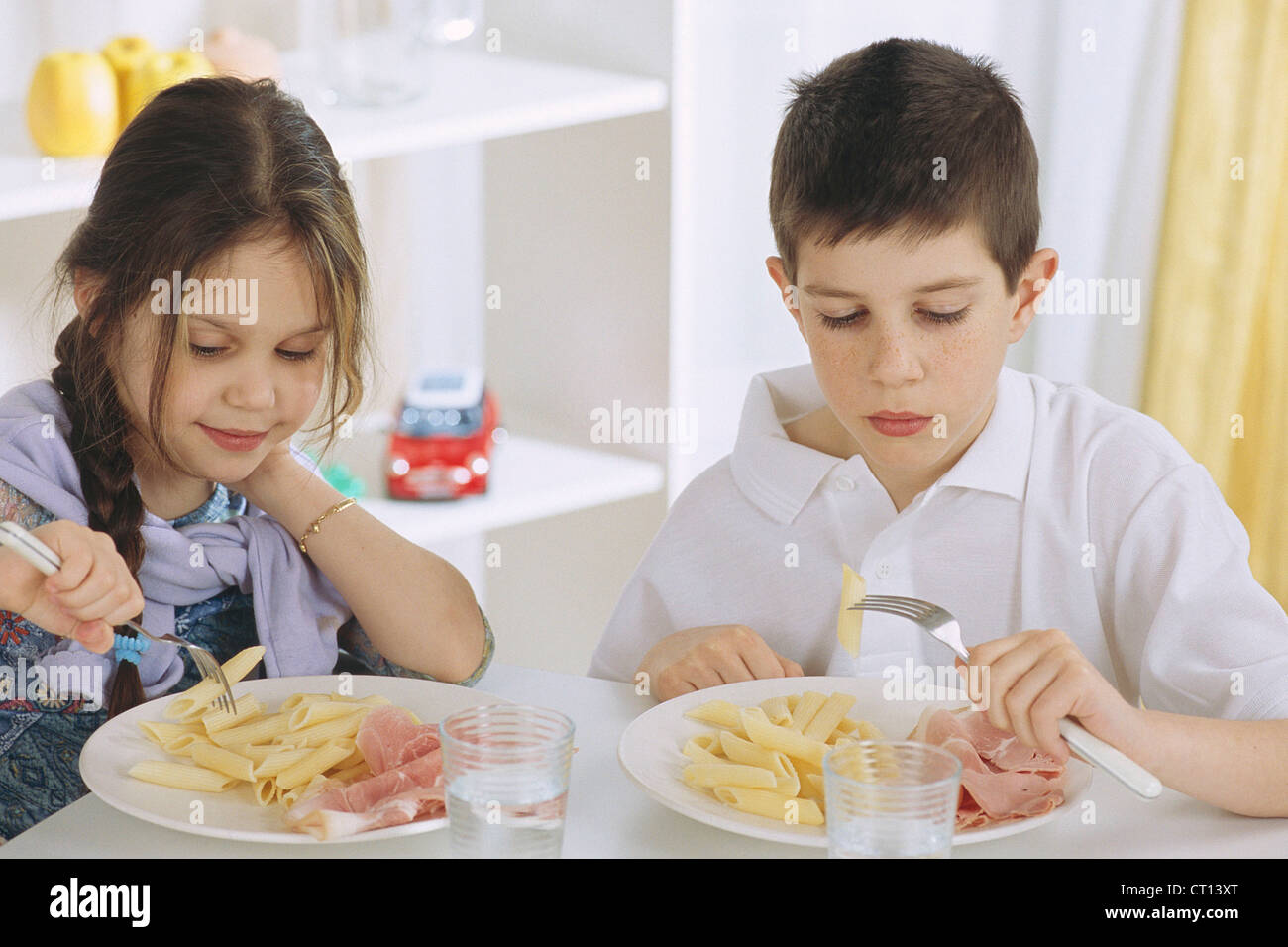 CHILD EATING STARCHY FOOD Stock Photo - Alamy