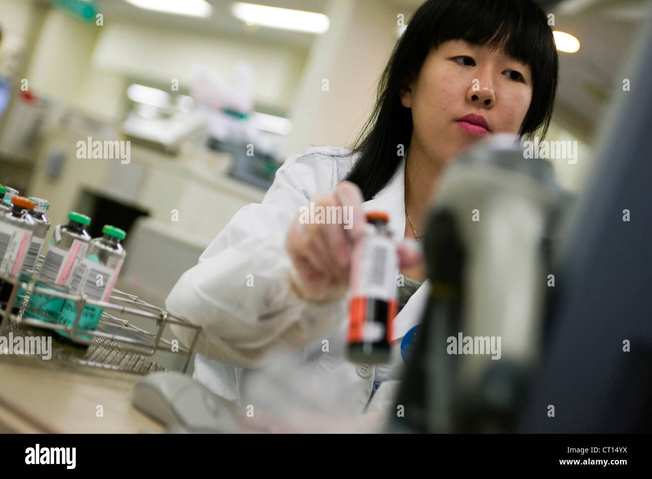 A lab technician in a blood analysis center Stock Photo - Alamy
