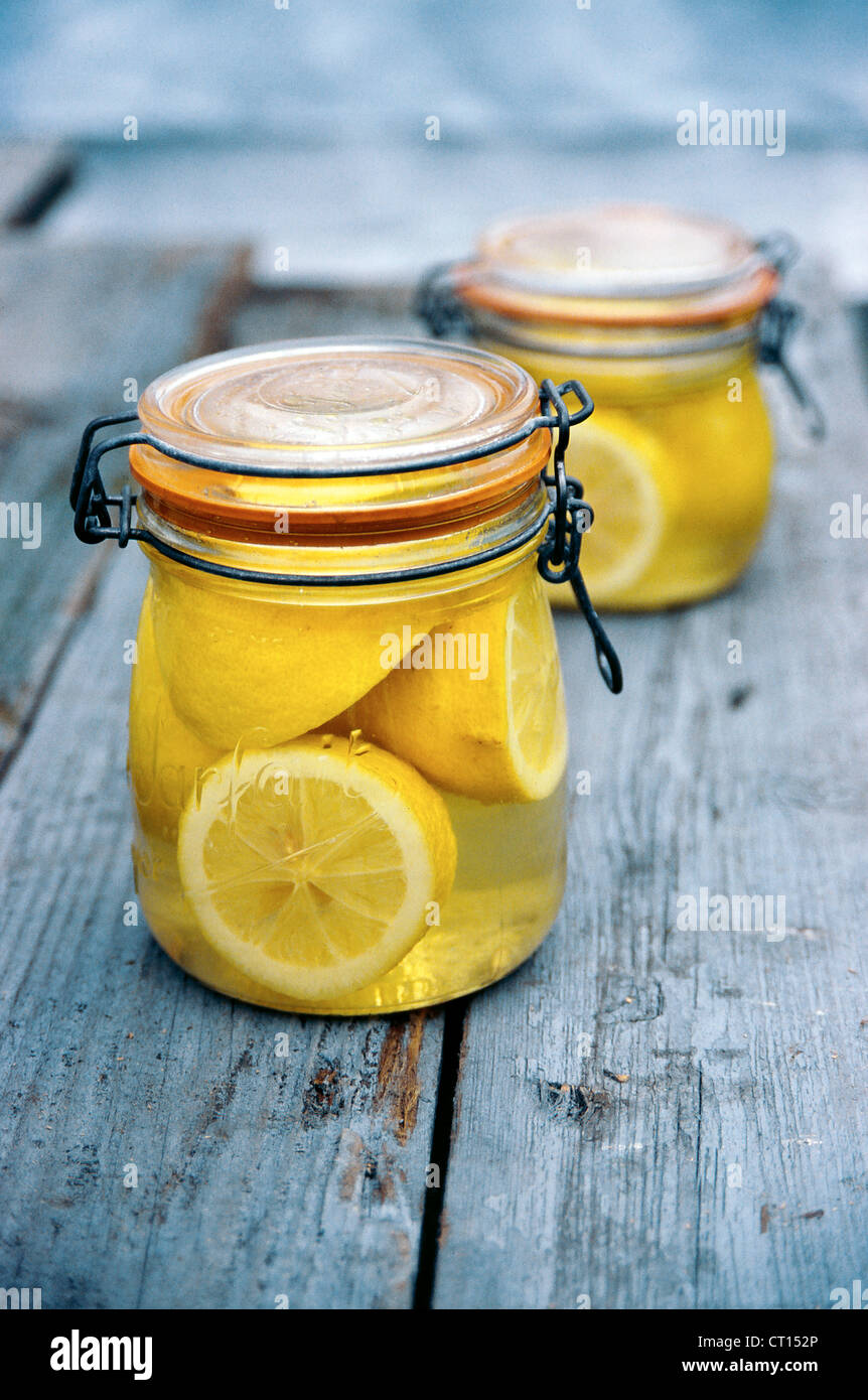 Jar of lemons in juice Stock Photo - Alamy