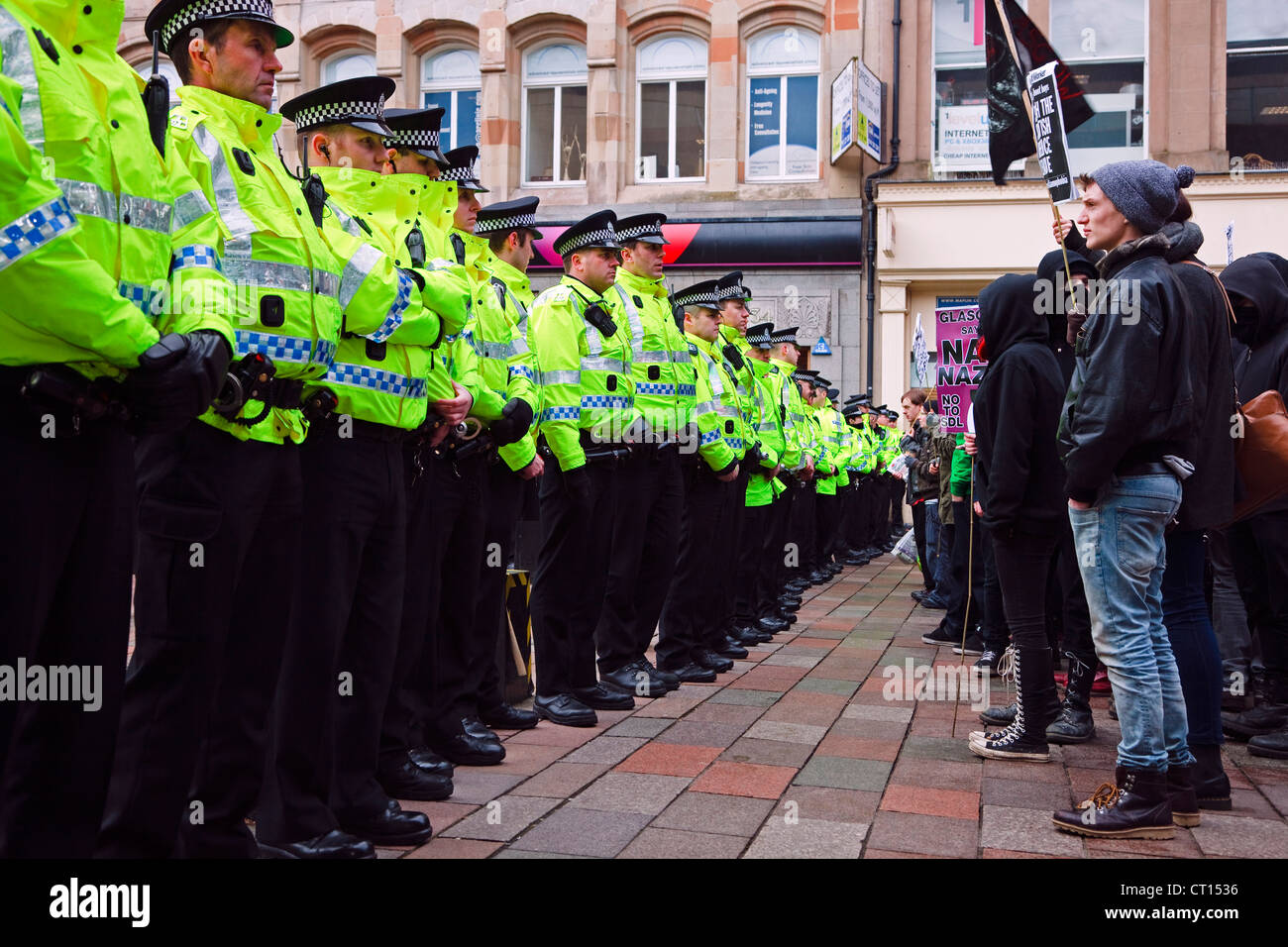 Line of Police officers confronting protest marchers, Glasgow, Scotland ...
