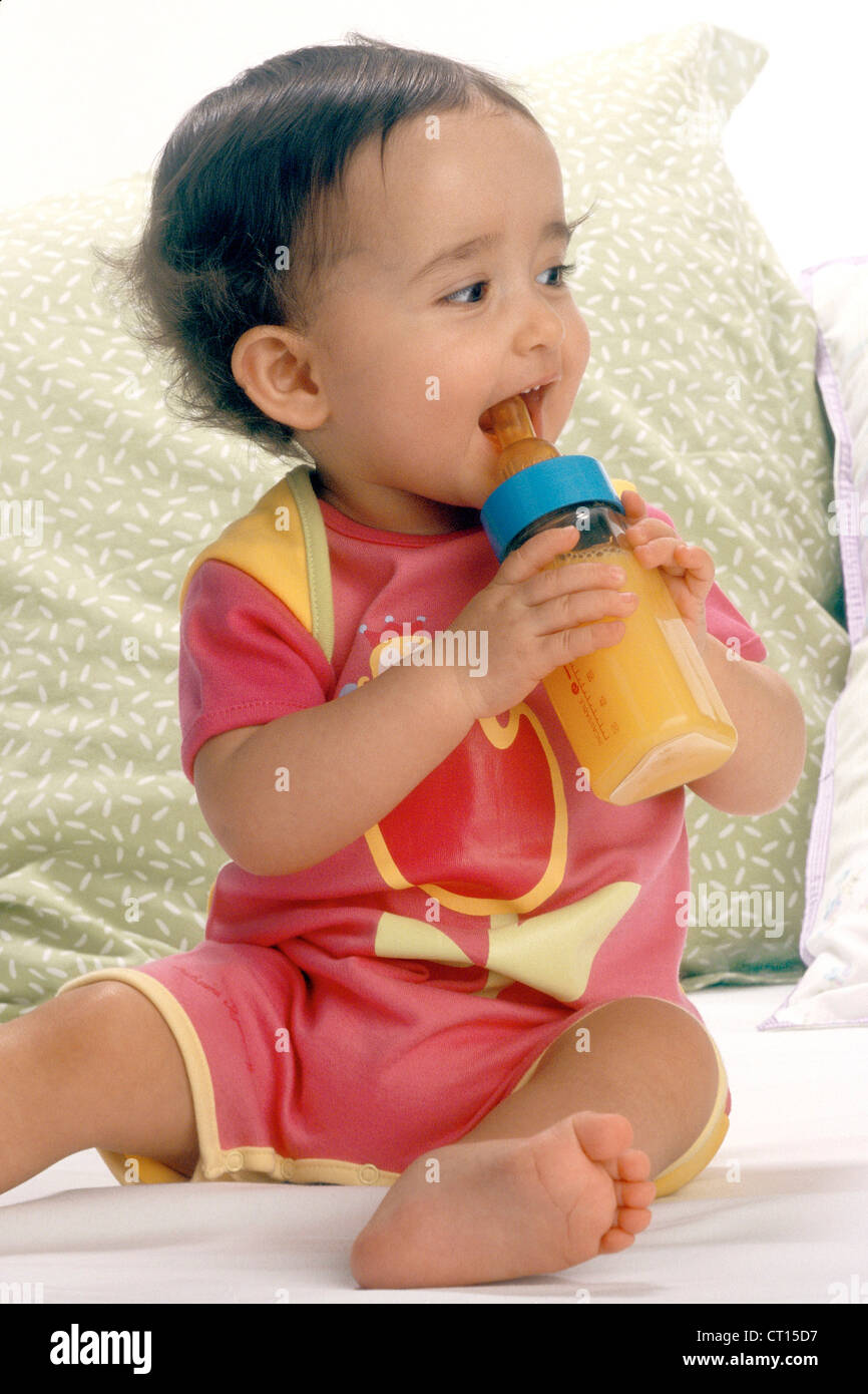 INFANT DRINKING FROM BABY BOTTLE Stock Photo - Alamy