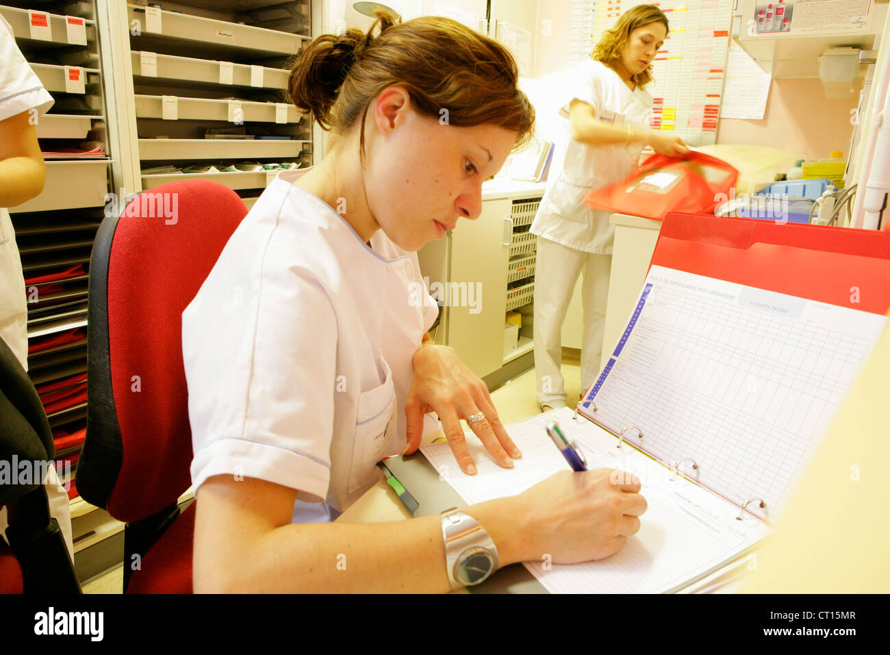 NURSE WITH PATIENT'S RECORD Stock Photo - Alamy