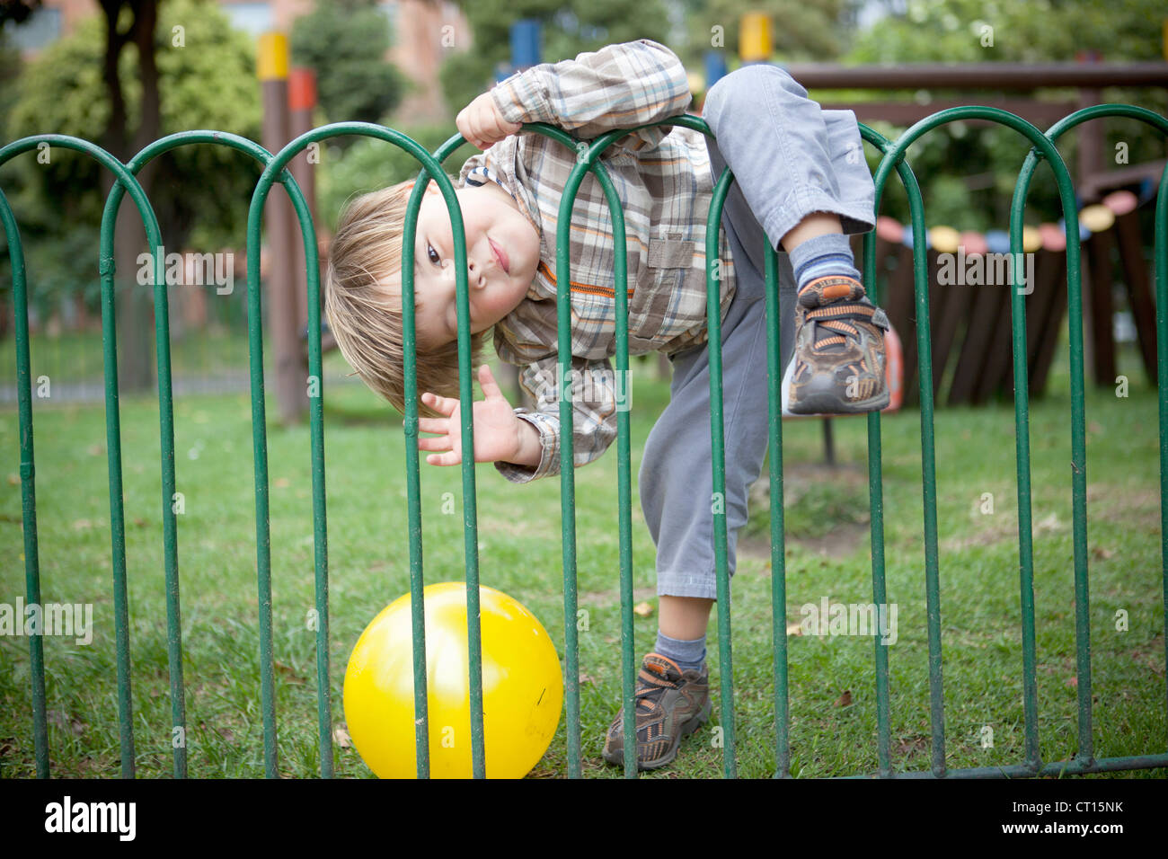 Children playing park fence hi-res stock photography and images - Alamy