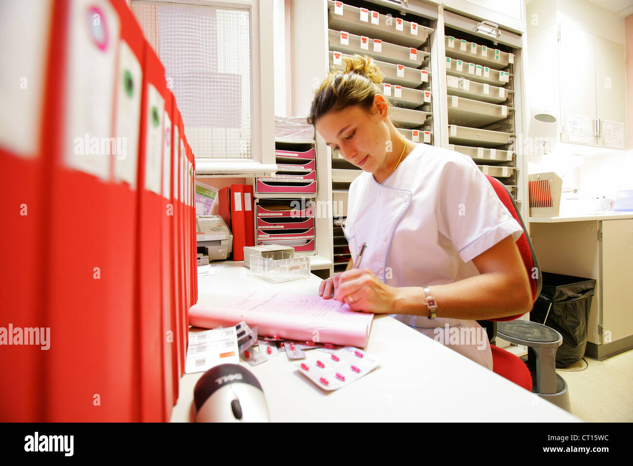 NURSE WITH PATIENT'S RECORD Stock Photo - Alamy