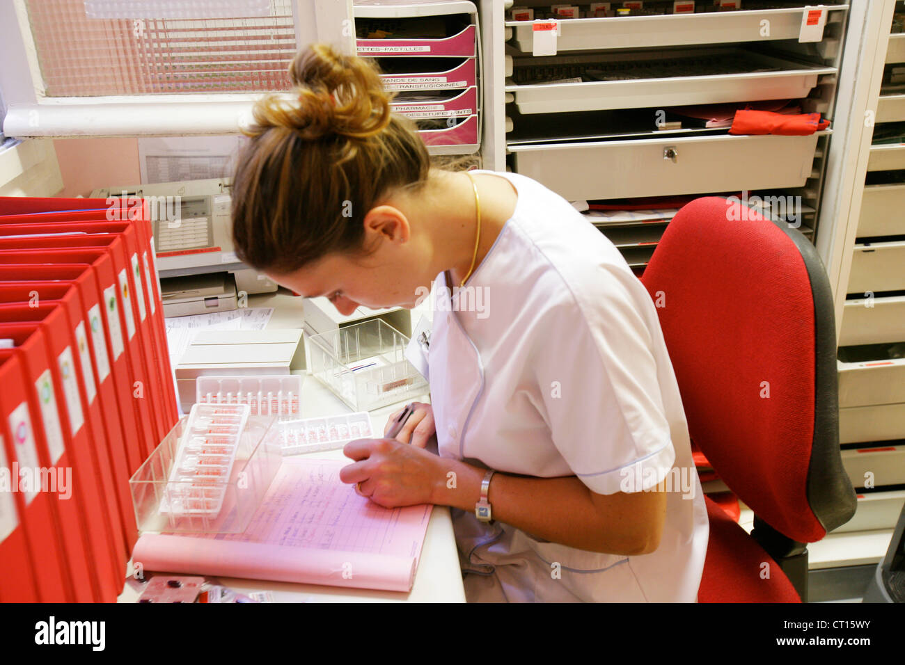 NURSE WITH PATIENT'S RECORD Stock Photo - Alamy