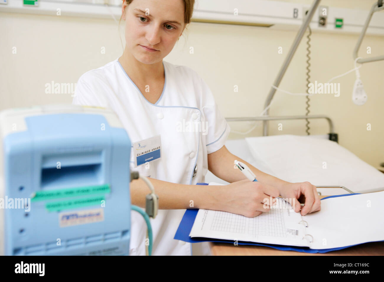 NURSE WITH PATIENT'S RECORD Stock Photo - Alamy