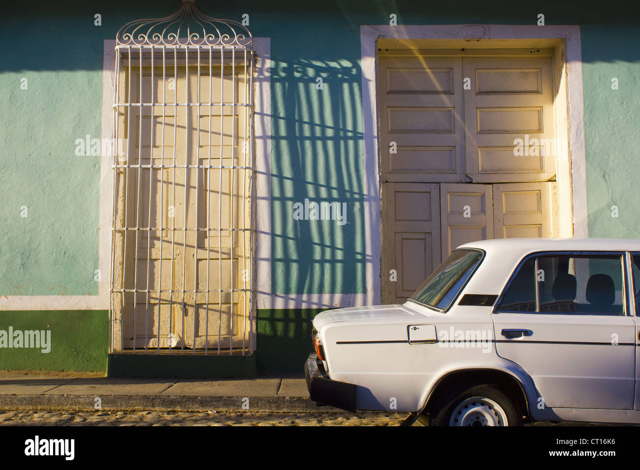 Front door gate casting shadows Stock Photo - Alamy