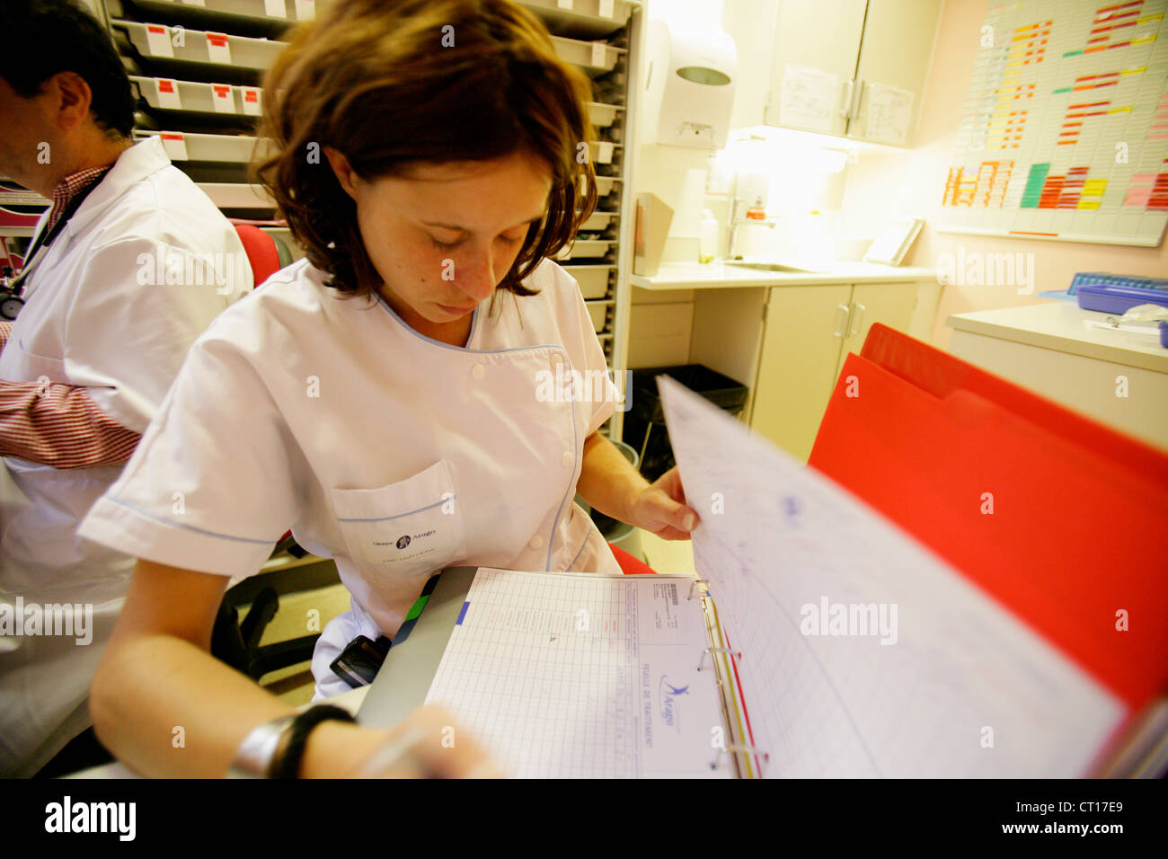 NURSE WITH PATIENT'S RECORD Stock Photo - Alamy