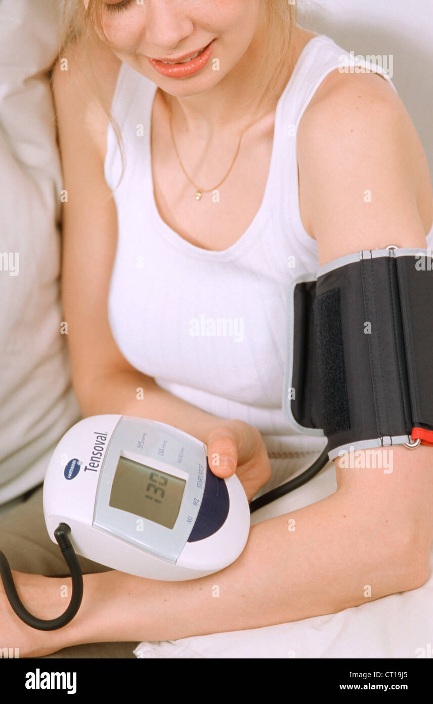 BLOOD PRESSURE, WOMAN Stock Photo - Alamy
